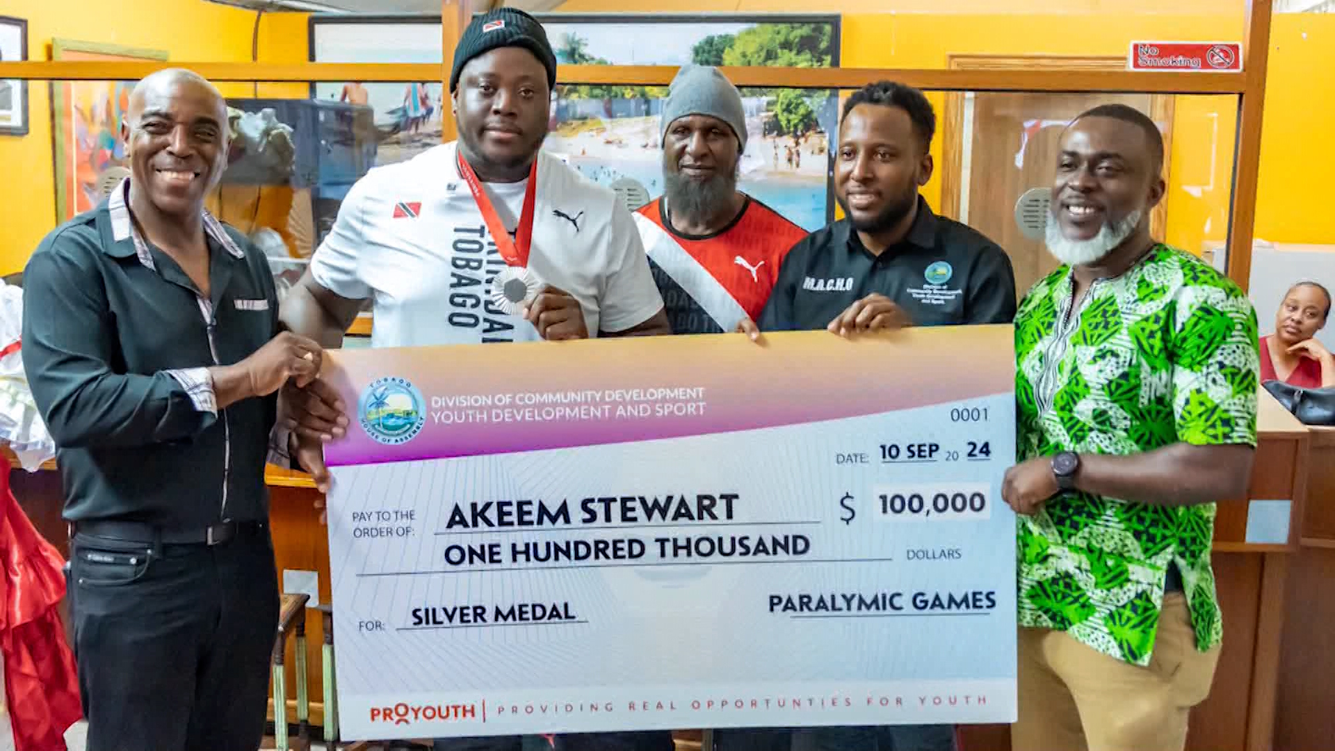 Akeem Receives $100,000 Cheque From THA Division - TTT News